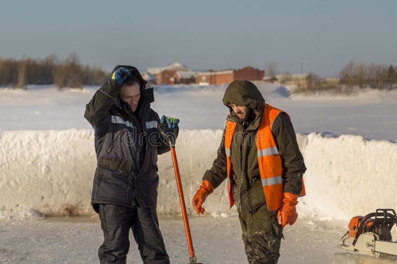 Two Workers in Overalls at a Construction Site Stock Image - Image of ...