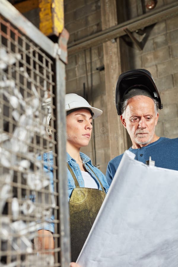 Two Workers Planning Metal Construction Production Stock Photo - Image ...