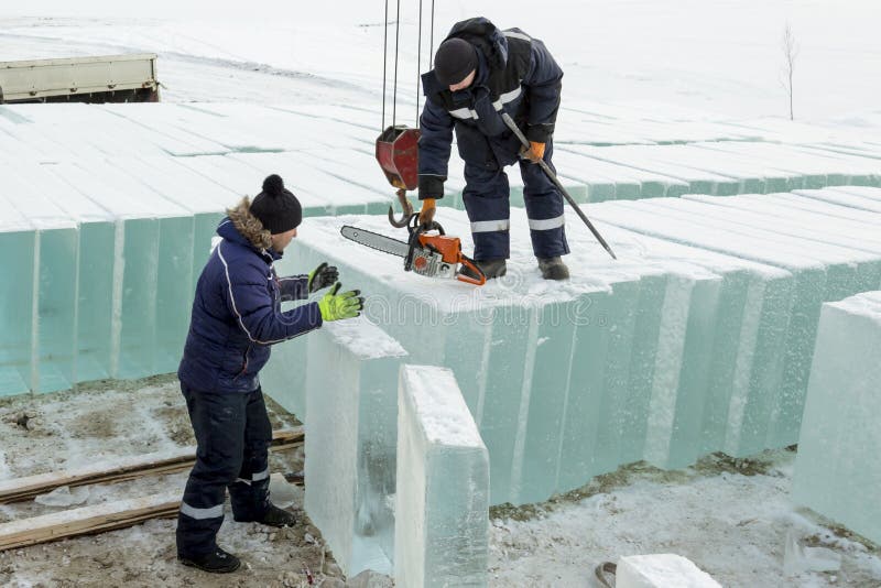 Two Workers Prepare Ice Panels for the Ice Town for Loading Stock Photo ...