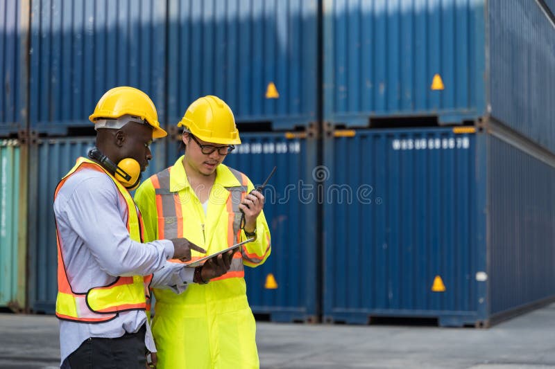 Engineer with Digital Tablet Works on a Field of Wind Turbines Stock ...