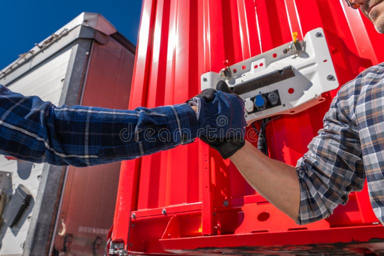Handshake between Two Workers at a Logistics Yard with a Red Shipping ...