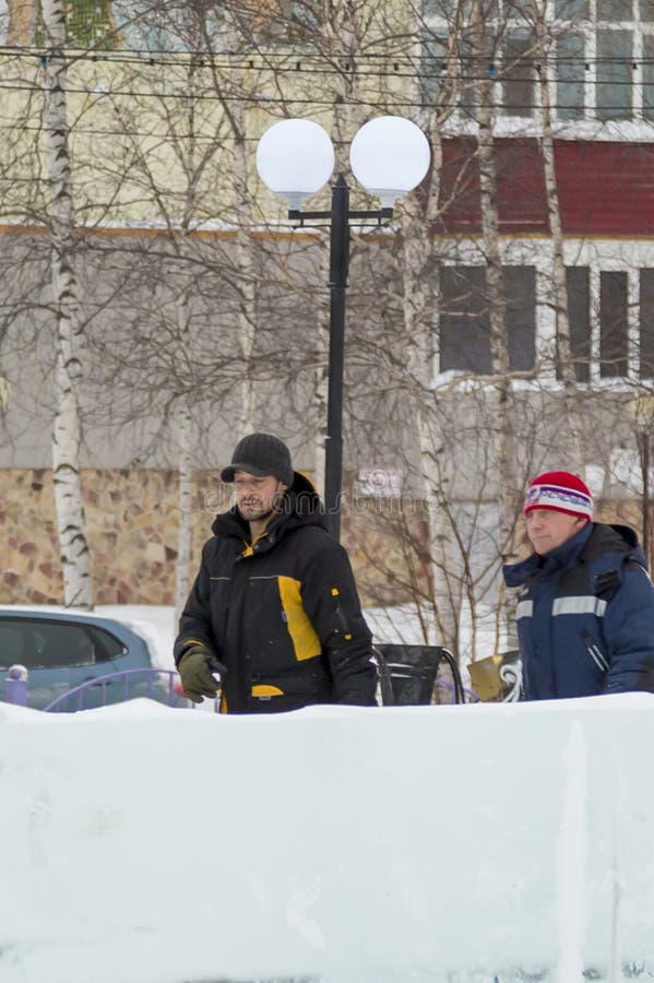 Two Workers at the Site of the Ice Camp Stock Photo - Image of carving ...