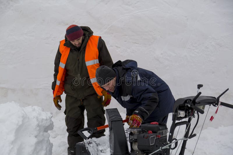 Two Workers in a Snowstorm at Snow Removal Stock Image - Image of ...