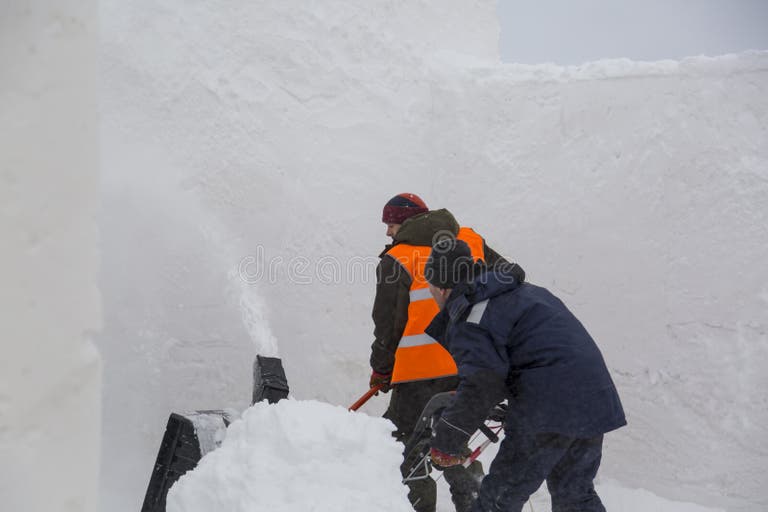 Two Workers in a Snowstorm at Snow Removal Stock Photo - Image of ...