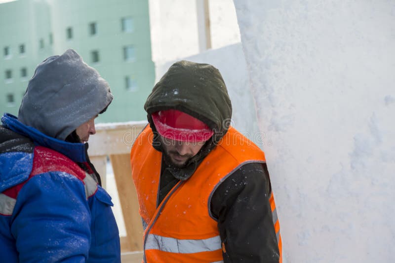 Two Workers Talk on the Assembly Site Stock Photo - Image of carving ...