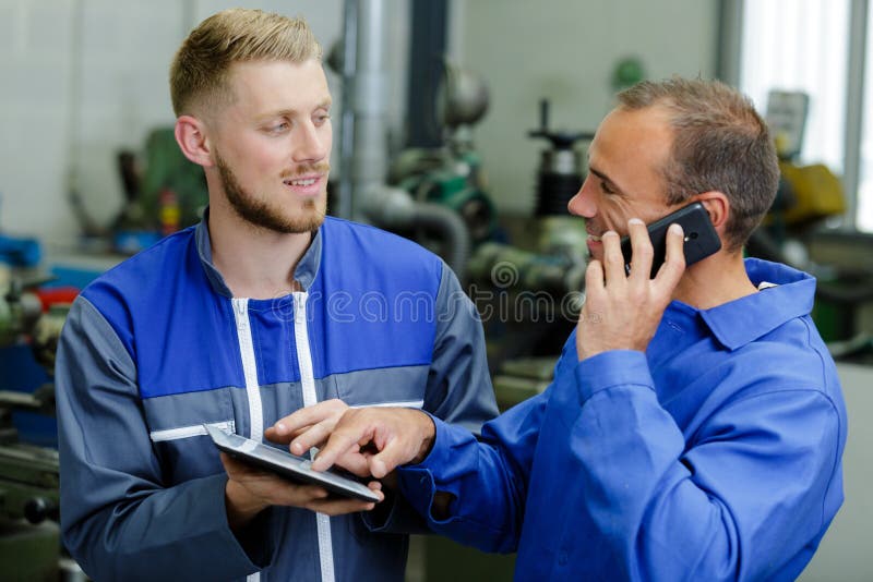 Two Workers Talking in Factory Stock Photo - Image of craftsman ...