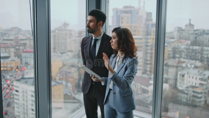 Two Workers Talking Office Corridor Looking on City. Colleagues ...