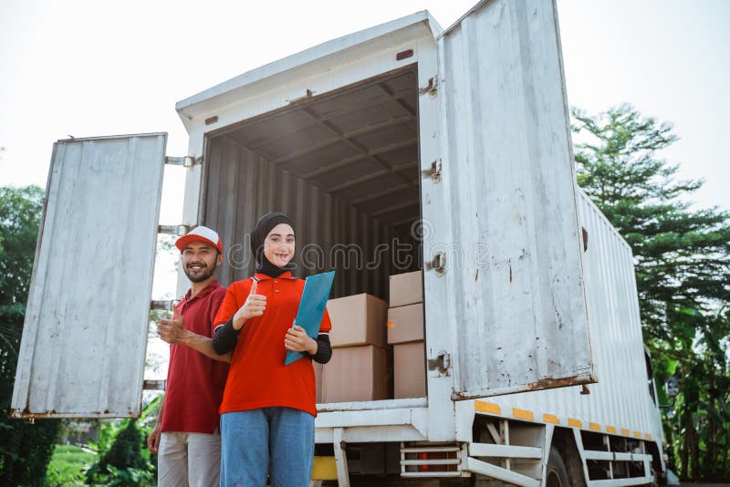 Two Workers with Thumbs Up Standing Behind a Logistics Container Stock ...