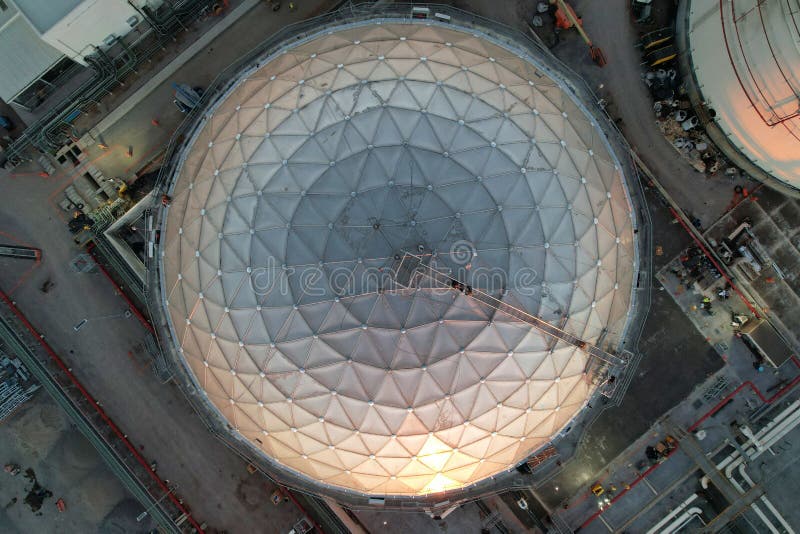 Workers on Top of a Sphere Dome Building Near a Coast Stock Image ...