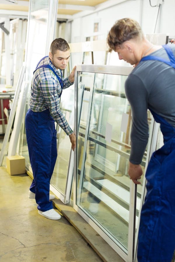 Two workers in uniform stock image. Image of facility - 46974569