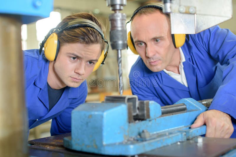 Two Workers Using Bench Drill Stock Photo - Image of drill, work: 117903538