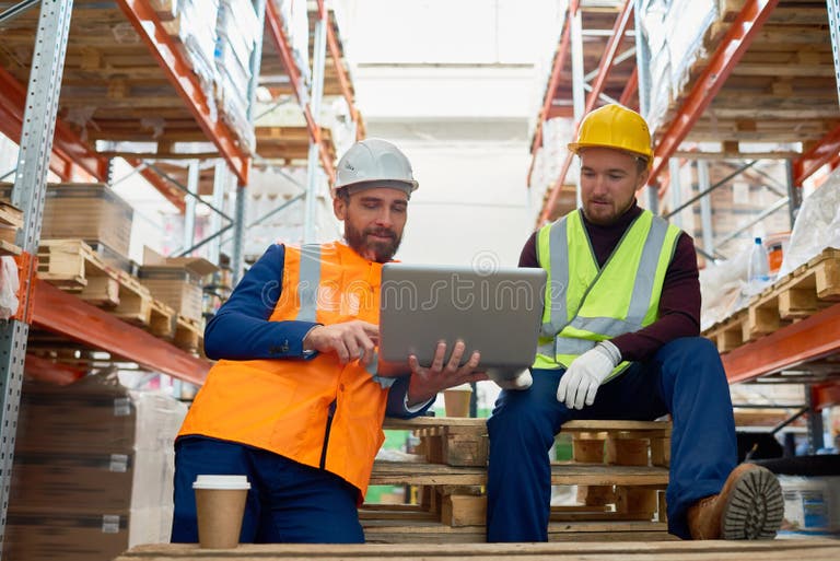 Two Workers Using Laptop in Warehouse Stock Image - Image of goods ...