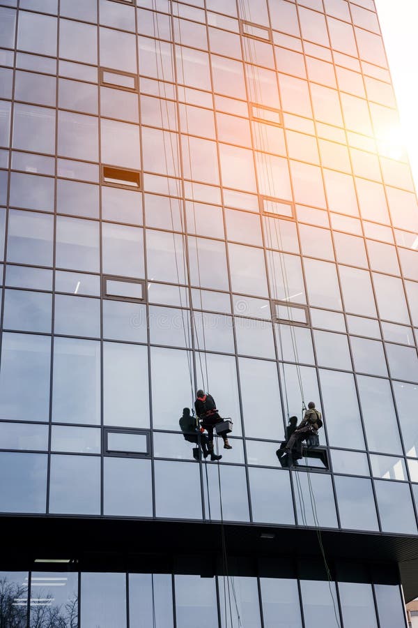 Two Workers Washing Windows Stock Photo - Image of hanging, safety ...