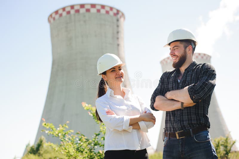 Two Workers Wearing Protective Helmet Works at Electrical Power Stock ...