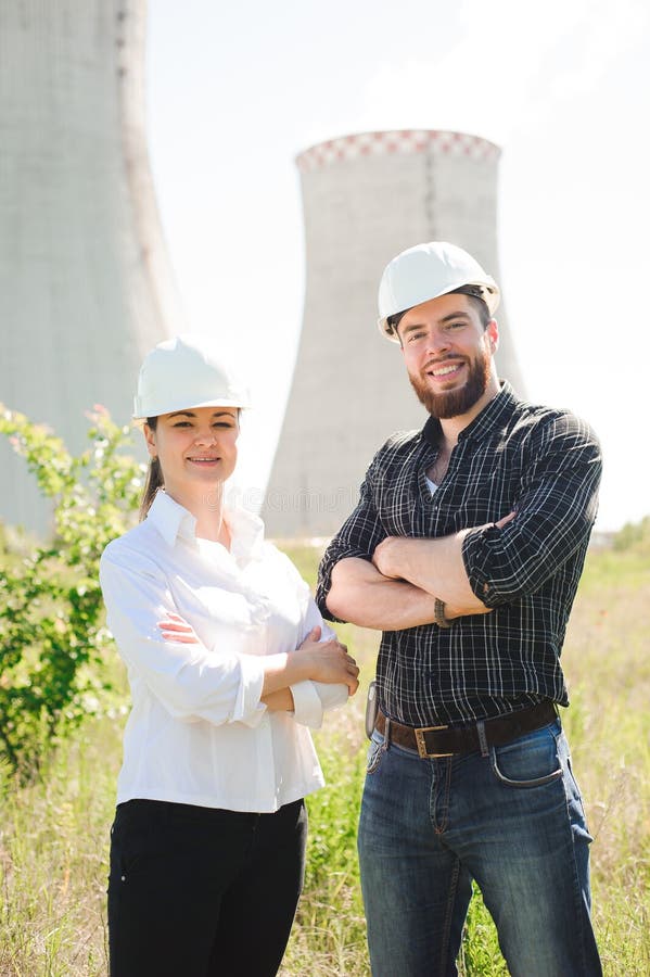 Two Workers Wearing Protective Helmet Works at Electrical Power Station ...