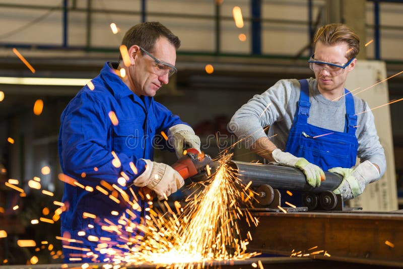 Two Workers Working with Angle Grinder Stock Image - Image of gloves ...