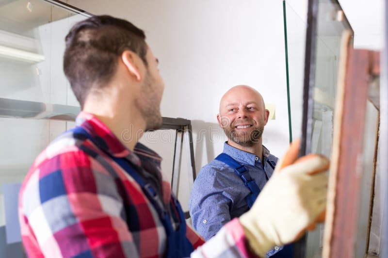 Two Workers Working with Glass Stock Photo - Image of plastic, builder ...