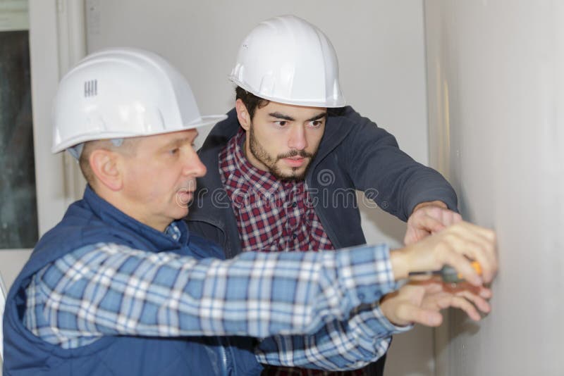 Two Working Builders Applies Glue on Wall Stock Image - Image of mortar ...