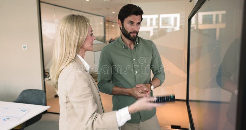 Two Workmates Stand at TV Screen Discussing Shown Visual Data Stock ...