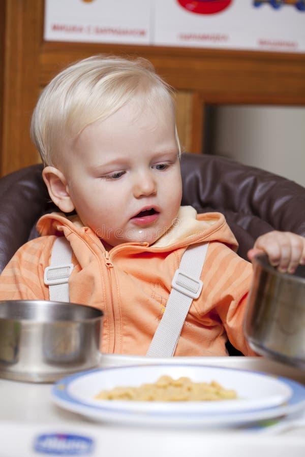 Two Year Baby Boy Sitting at the Dinner Table Stock Photo - Image of ...