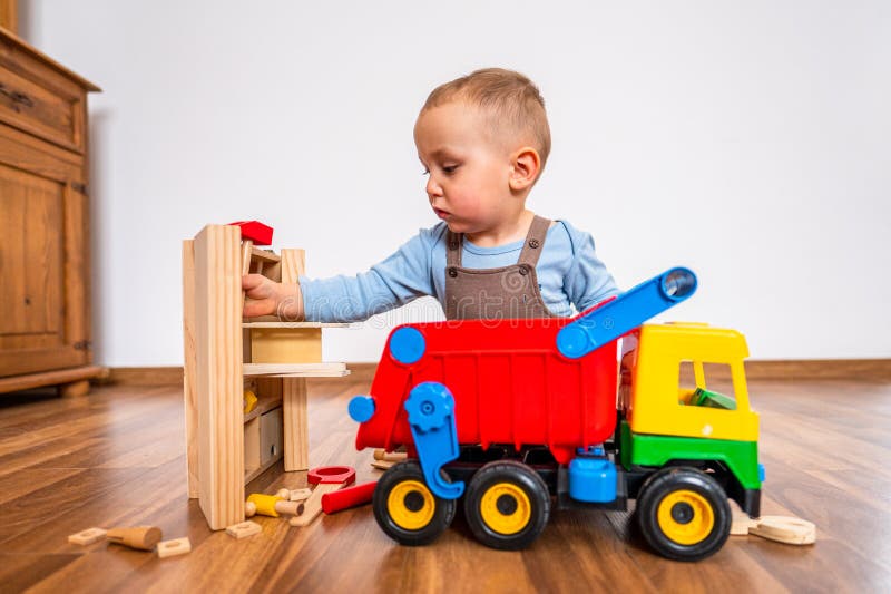 A Two-year-old Boy Playing Car Mechanic Stock Image - Image of creative ...