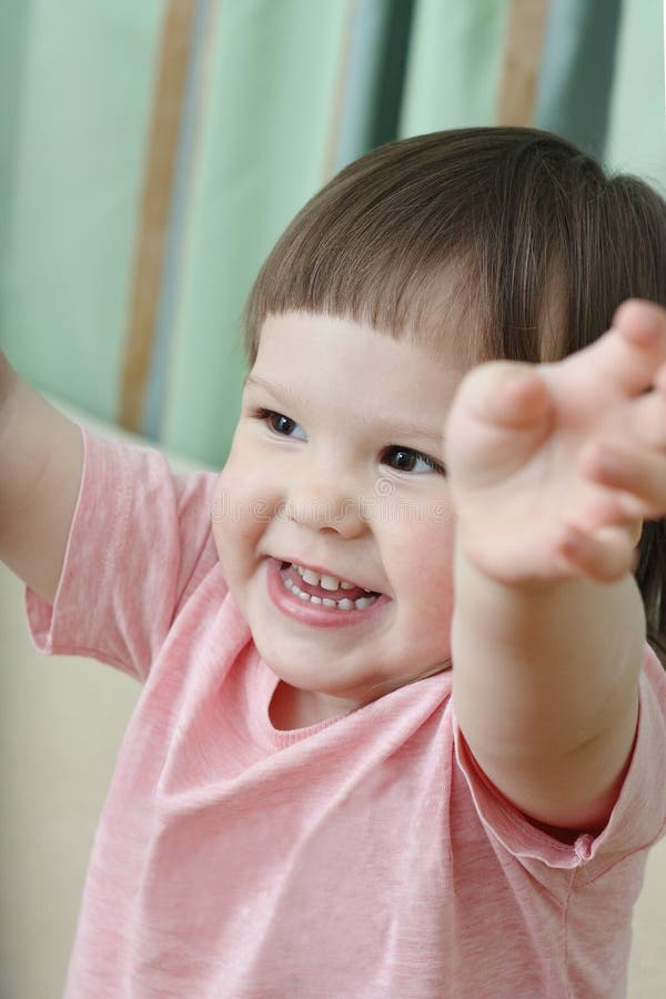 Two-year-old girl stock photo. Image of raise, happy, dress - 5873336