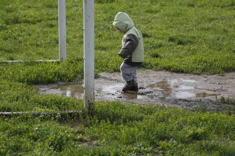 Two Years Child Walk and Playing in Muddy Puddle Stock Photo - Image of ...