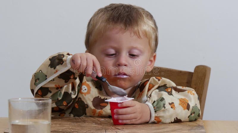 Two Years Old Boy Eating a Yogurt Stock Video - Video of innocent ...