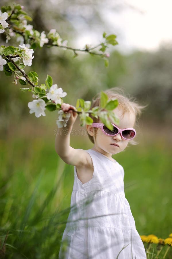Two Years Old Toddler Girl and Blossoming Tree Stock Image - Image of ...