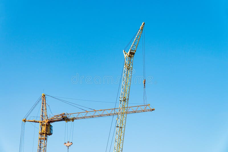 Two Yellow Construction Cranes. Construction of Buildings Stock Photo ...