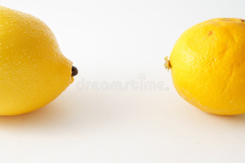 Two yellow lemons stock image. Image of closeup, lemon - 260120455