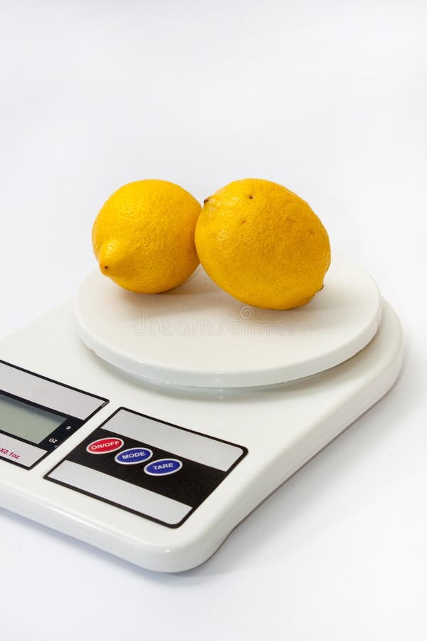 Two Yellow Lemons on White Kitchen Digital Scale Stock Photo - Image of ...