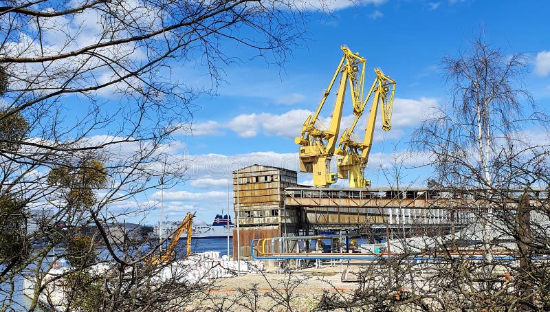Two Yellow Loading Cranes and an Old Port Building Stock Image - Image ...
