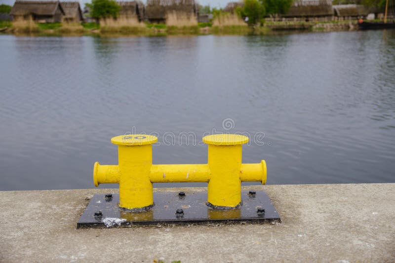 Two Yellow Mooring Post at the Harbor or Marina Port Stock Photo ...