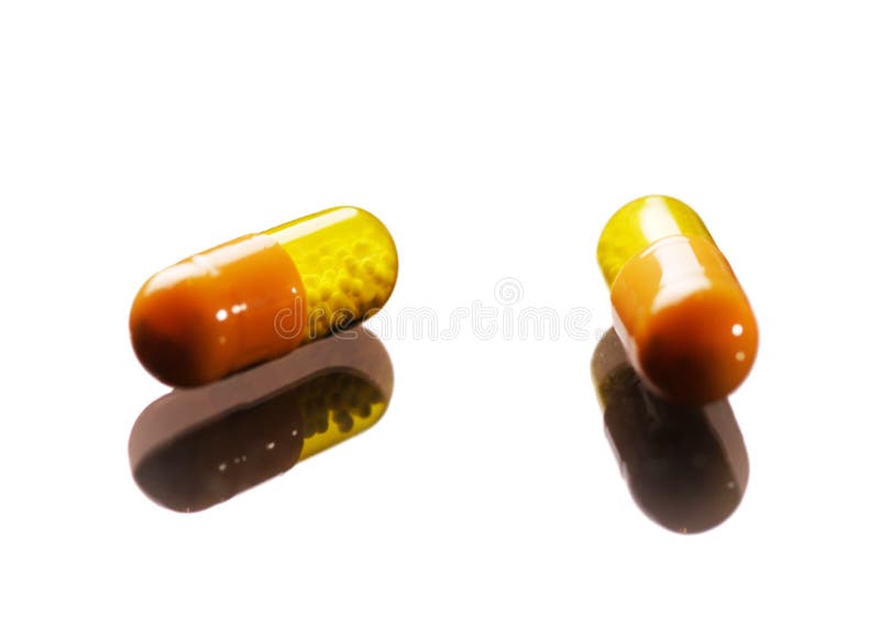 Two Yellow and Orange Color Pills Stock Photo - Image of pill, orange ...