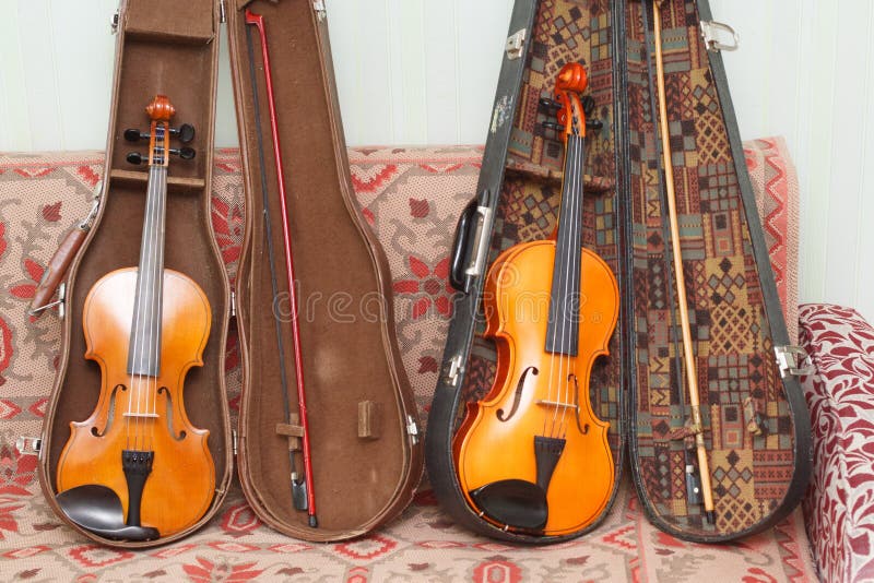 Two yellow-orange violins stock photo. Image of ready - 181022654