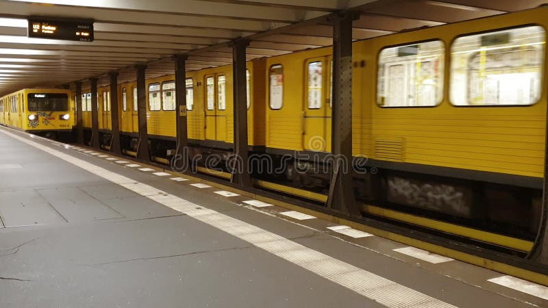 Two Yellow Trains in Berlin Subway, Arriving and Leaving Platform ...