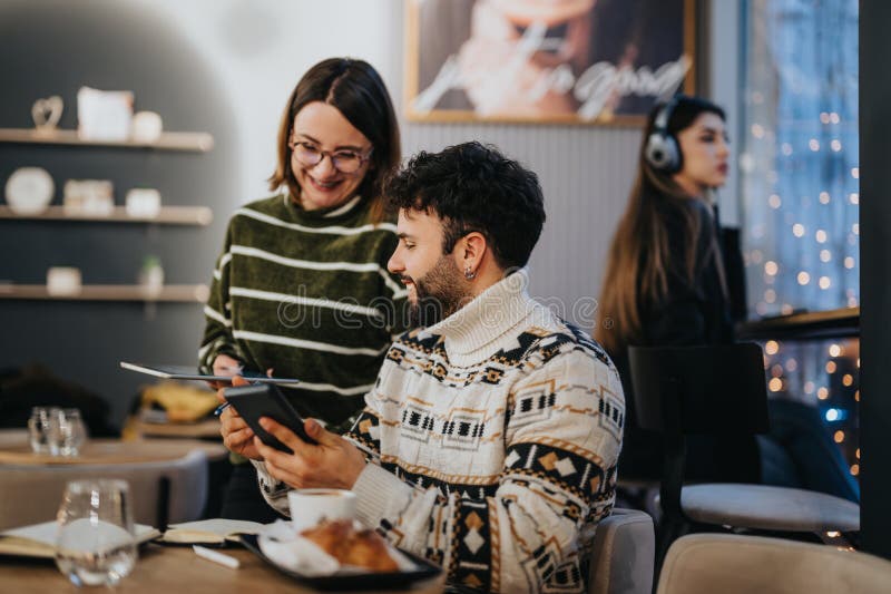 Two Young Adults Engage in a Collaborative Work Session, Sharing Ideas ...