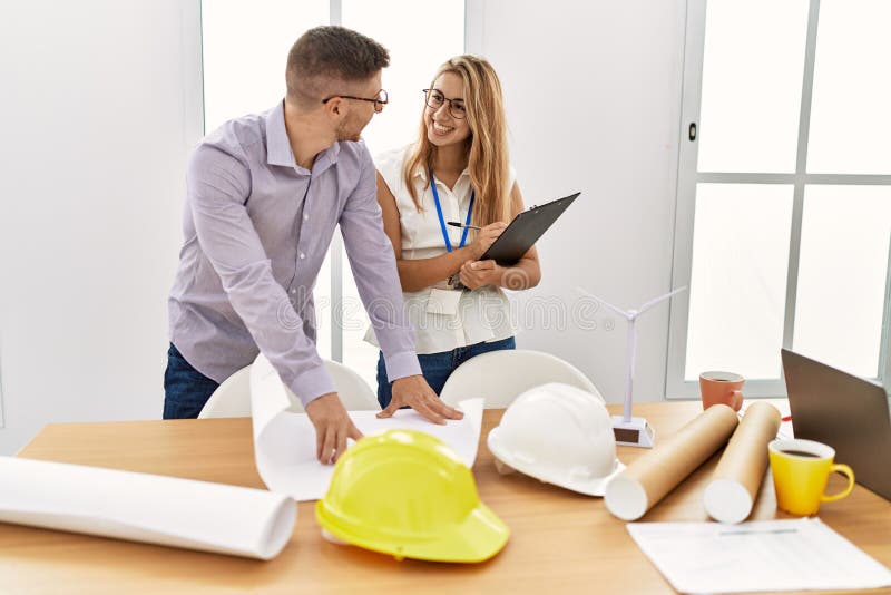 Two Young Architect Smiling Happy Working at Architecture Studio Stock Image - Image of boss ...