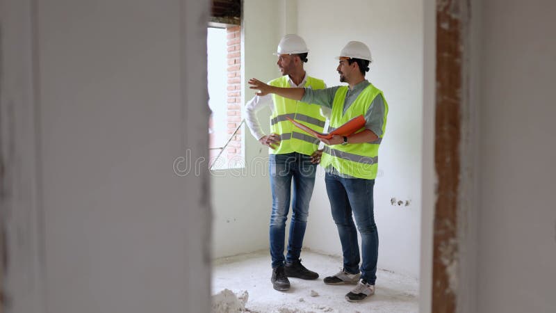 Two Young Architects Male Working Together at Construction Site Stock ...