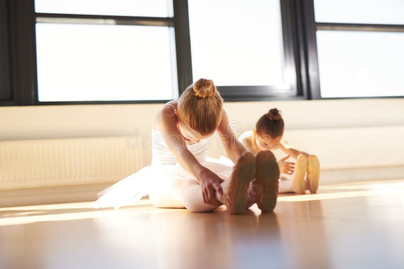 Little Ballerinas Stretching Their Legs Using Bar Stock Photo - Image ...