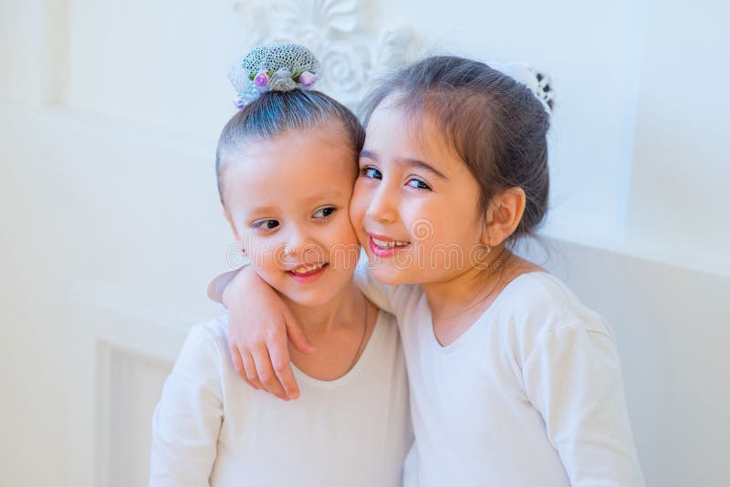 Two Young Ballet Dancers Hug Stock Photo - Image of ballerina, female ...
