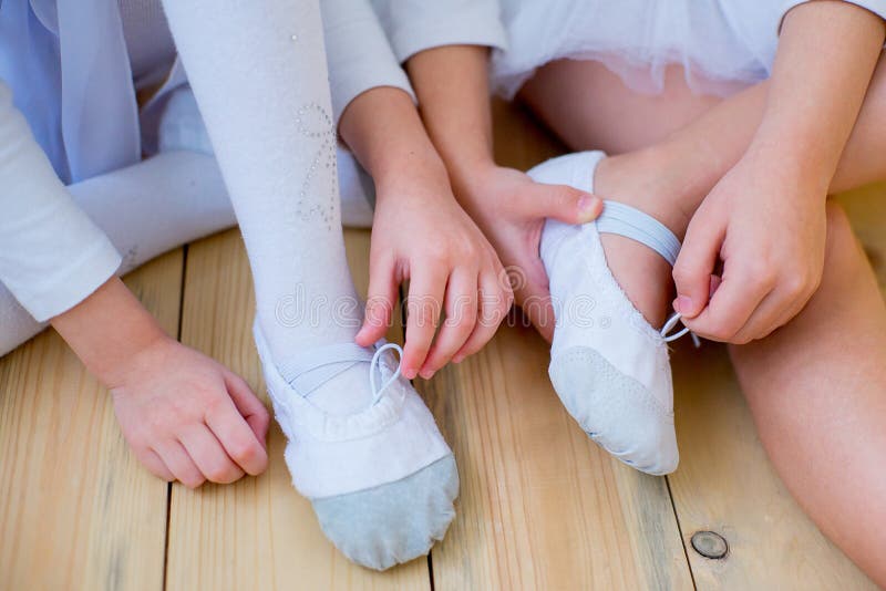 Two Young Ballet Dancers Preparing for Lesson Stock Image - Image of ...