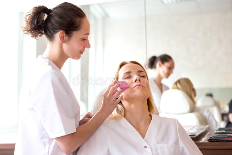Two Young Beautician Students Working during Make Up Classes Stock ...