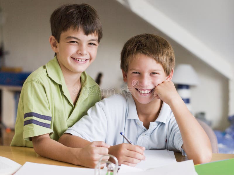 Two Young Boys Doing Their Homework Together Stock Image - Image of ...