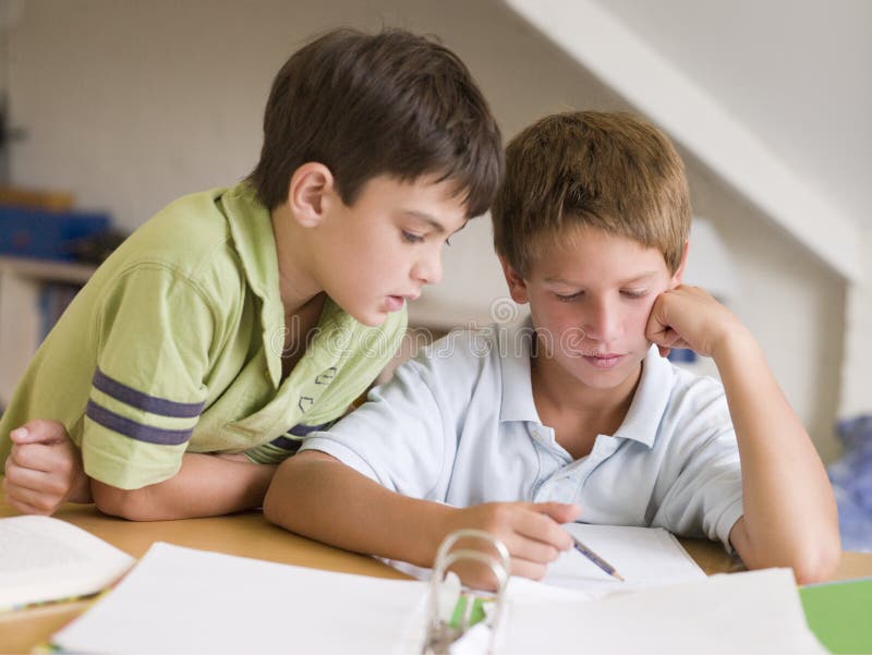 Two Young Boys Doing Their Homework Together Stock Photo - Image of ...