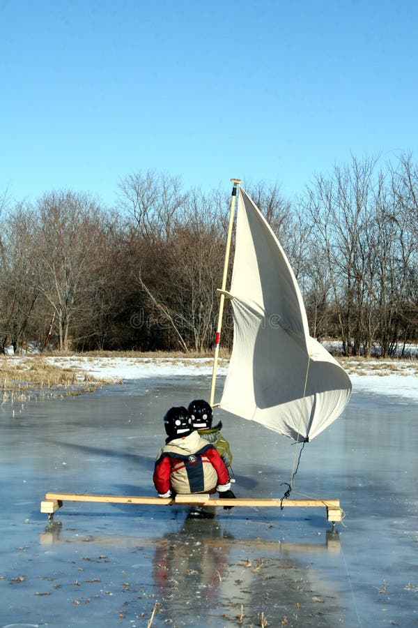 Two Young Boys on Ice Boat with Sails Stock Image - Image of rear ...
