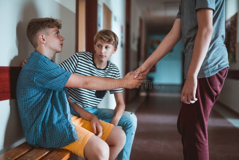 Young Boys Say Hello To Each Other at the School Corridor Stock Photo ...