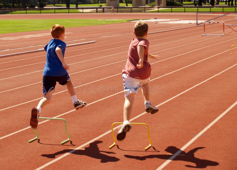 Two Young Boys with Small Hurdles Stock Photo - Image of sunshine ...