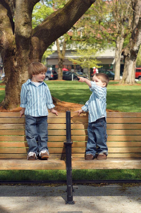 Two Young Brothers - Park Bench Stock Photo - Image of together, dress ...